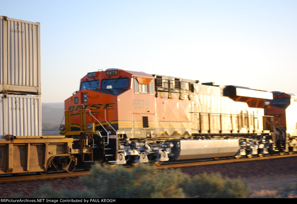 The Rising Sun Gleems off this Very Very Brand New ES44C4 (BNSF 6678) as she follows her Sister ...